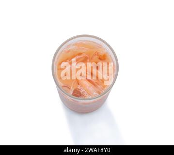 Top view of orange Thai iced condensed milk tea in transparent plastic ...