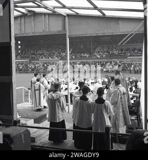 1960s, historical, roman catholic clergy met parishioners outside Stock ...
