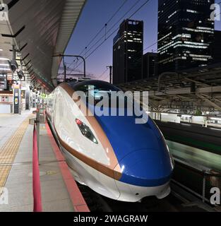 Japanese E7 series Shinkansen, bullet train, coming into Tokyo station ...