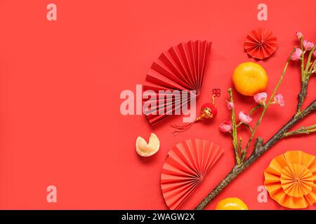 Sakura branch with fortune cookie and Chinese symbols on yellow ...