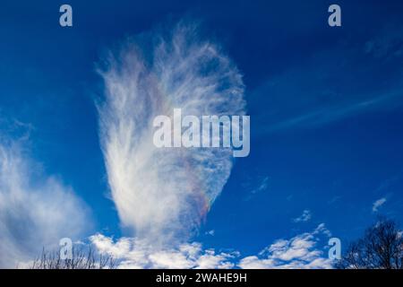 Stratus cloud with rare rainbow effect on blue sky Stock Photo - Alamy