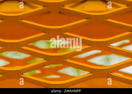 Macro of yellow metal grate with blurred background Stock Photo - Alamy
