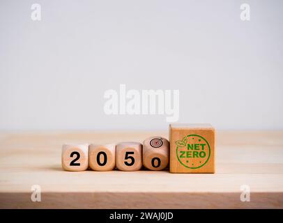 2050 year number with Net Zero icon and target symbol on wooden blocks ...