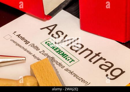 Symbol image: Application form for asylum in Germany Stock Photo - Alamy