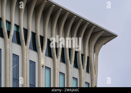 contemporary glass office building with wavy facade under construction ...