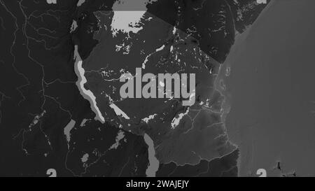 Tanzania highlighted on a Grayscale elevation map with lakes and rivers ...