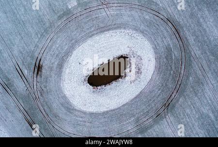 Rehna, Germany. 05th Jan, 2024. A thin layer of snow lies on a field ...