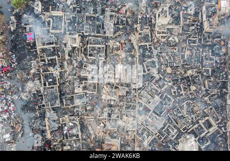 A photo shows burnt houses due to forest fire in Imabari City, Ehime ...