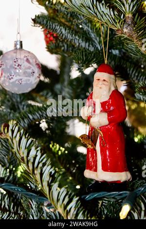 Ceramic Bell Christmas Tree with Red Bows Stock Photo - Alamy