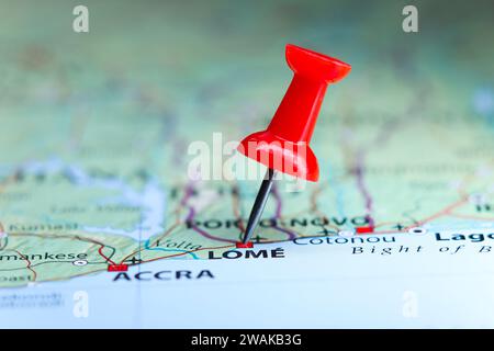 red pin needle into lome city of togo political map Stock Photo - Alamy