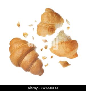 Delicious fresh croissants falling on white background Stock Photo - Alamy