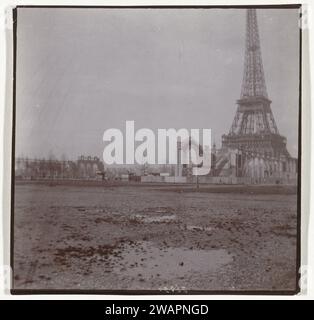Construction of pavilions next to the Eiffel Tower for the World ...