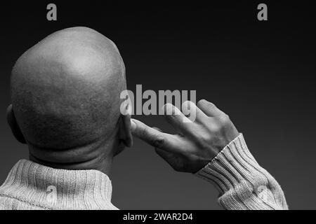 deaf man suffering from deafness and hearing loss on grey black ...