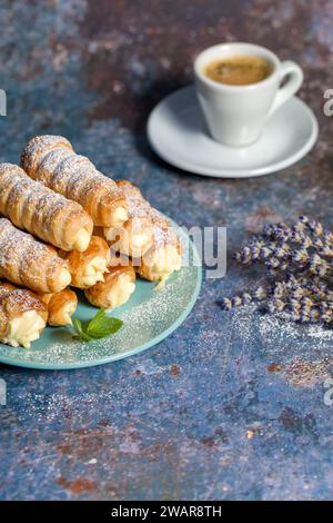 Delicious puff pastry tubes filled with custard Stock Photo - Alamy