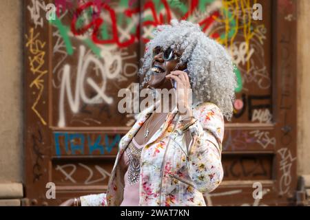 Stylish, afro-american lady with hoary afro hair and sunglasses ...