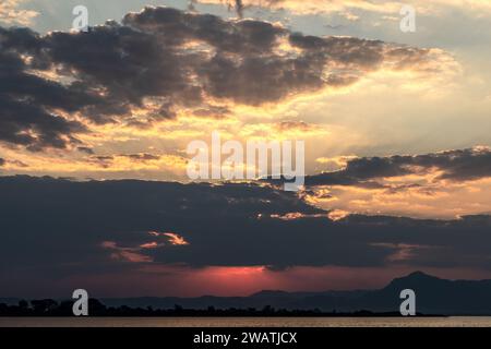 Dusk, sun & clouds, Shire river, Liwonde National Park, Malawi Stock ...