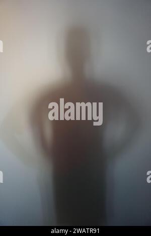 Anonymous man behind a frosted glass door Stock Photo - Alamy