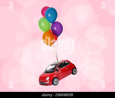 Many balloons tied to toy car flying on white background Stock Photo ...