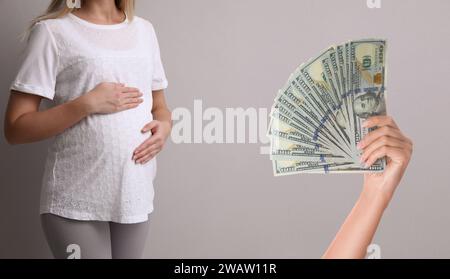 Surrogacy. Intended mother with money and pregnant woman on pink ...