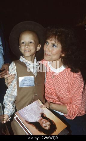 Country music superstar Loretta Lynn combs her hair on her tour bus ...