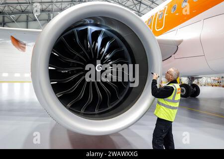 Olaf Gross, Licence Engineer at easyJet, checks the engine of an Airbus ...