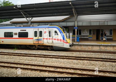 An arriving KTM Komuter train at Batu Tiga Station, Shah Alam, Selangor ...