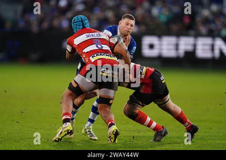 Gloucester's Zach Mercer is tackled by Exeter Chiefs' Greg Fisilau ...