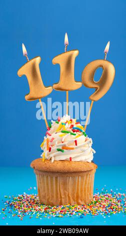 Candle number 119 - Cake birthday in blue background Stock Photo - Alamy