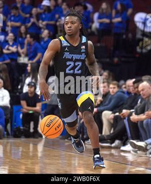 Marquette guard Sean Jones (22) gets past UCLA forward Berke ...