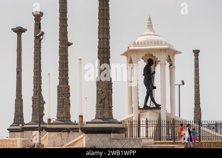 Child at the foot of a Mahatma Gandhi monument, statue, former French ...