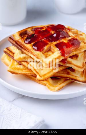 soft square waffles with strawberry jam, delicious and sweet dessert ...