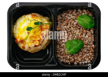 buckwheat with baked fish in lunch box on white background Stock Photo ...