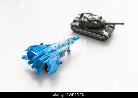 The image shows models of tanks and fighter jets on a white background ...