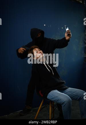 Man, kidnap and criminal with gun and phone call for money, ransom ...