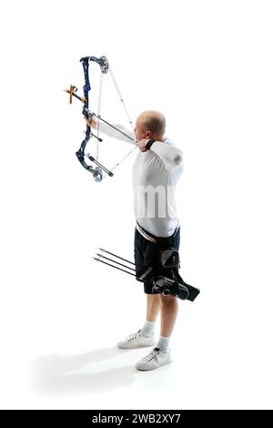 Full-length image of man, archer standing with archery bow and arrows ...