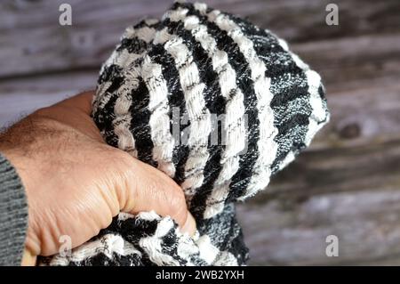 The Palestinian keffiyeh, a distinctly patterned black and white scarf ...