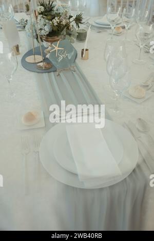 Chic dining setup. Luxurious table setting featuring delicate lights ...