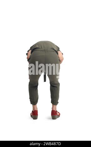 back view of a woman searching for something on the floor on white ...