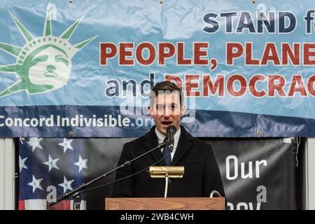 State representative Simon Cataldo speaking to a large group of people ...