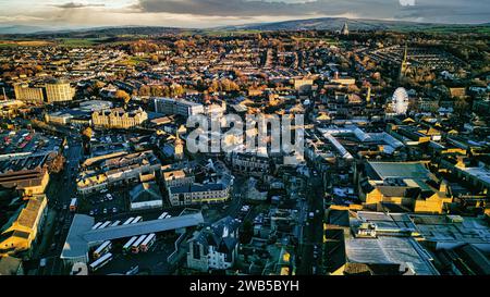 Aerial view of a city Lancaster at sunset with warm lighting ...