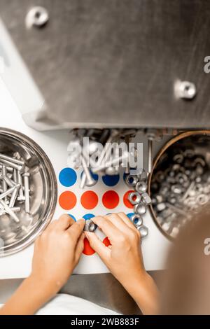 Kids play with magnets in science museum Stock Photo - Alamy
