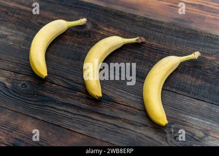 Three ripe organic, juicy, fragrant apples on a bamboo tray, close-up ...
