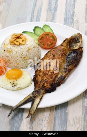 Bangsilog (milkfish, fried rice, and egg), traditional Filipino ...