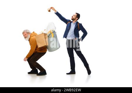 Sorting garbage types. Two men with trash bins on backs cleaning ...