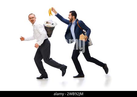 Sorting garbage types. Two men with trash bins on backs cleaning ...