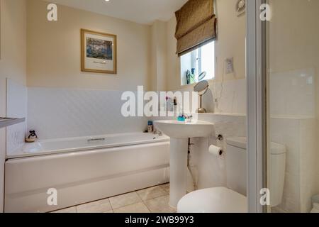 Traditional partially tiled bathroom Stock Photo - Alamy