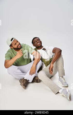 happy Juneteenth celebration, young african american man sitting with ...