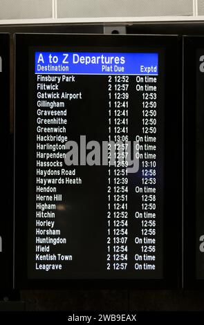 Digital destination display on a railway station platform, London ...