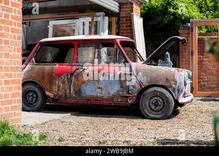 Fire damaged classic Mini car Stock Photo - Alamy