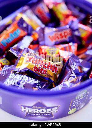 Box of Cadbury Heroes chocolates, lid opened to show contents isolated ...